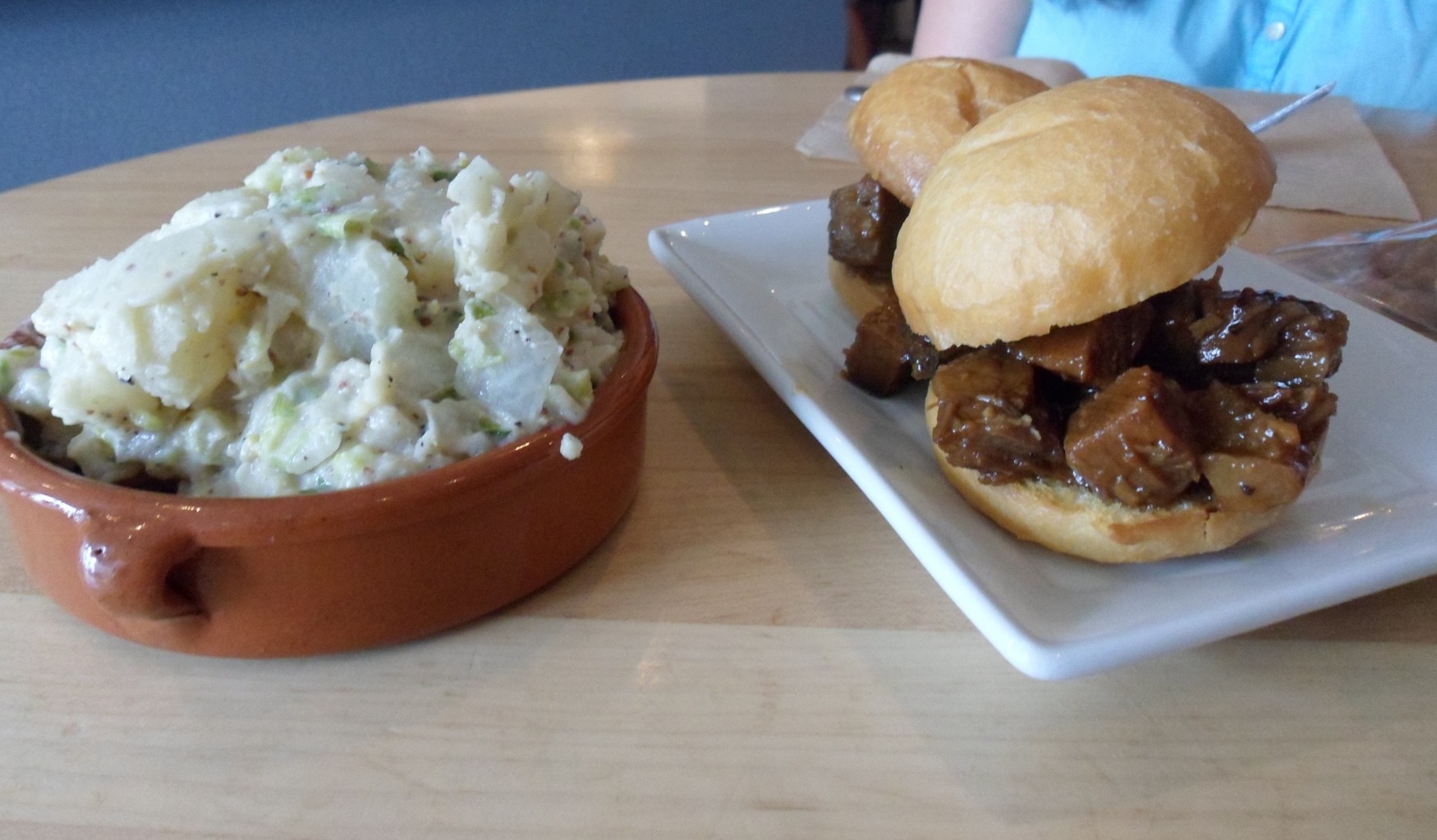 sliders and potato salad at cochon butcher - Heels First Travel